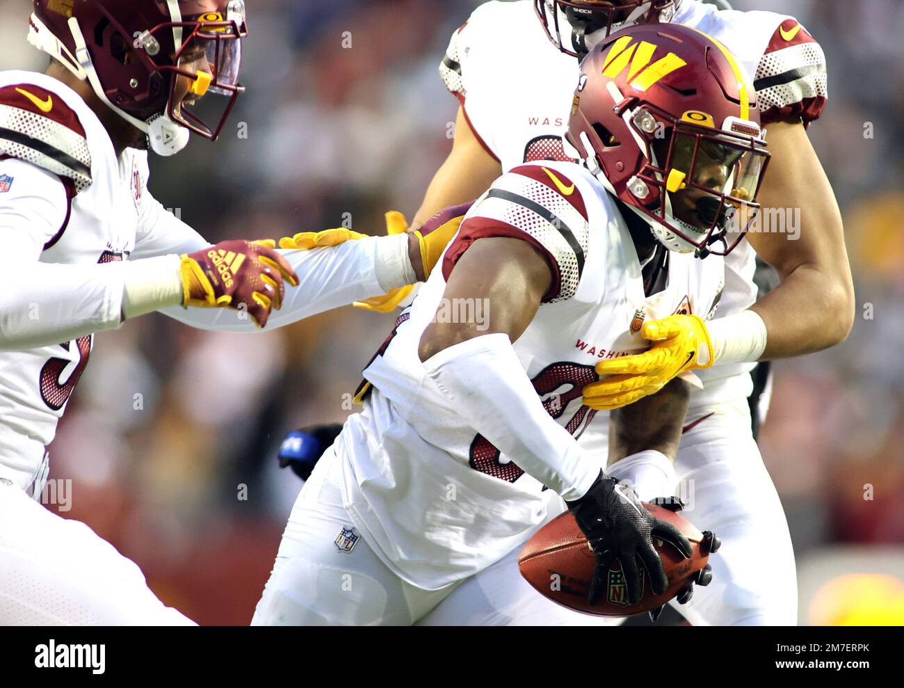 Washington Commanders cornerback Christian Holmes (34) recovers a ...