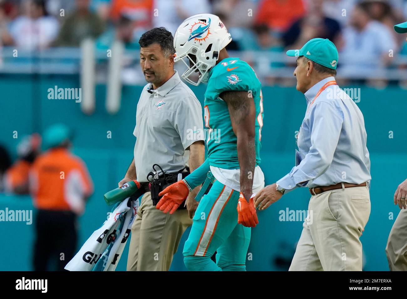 Miami Dolphins wide receiver Jaylen Waddle (17) is assisted off the ...