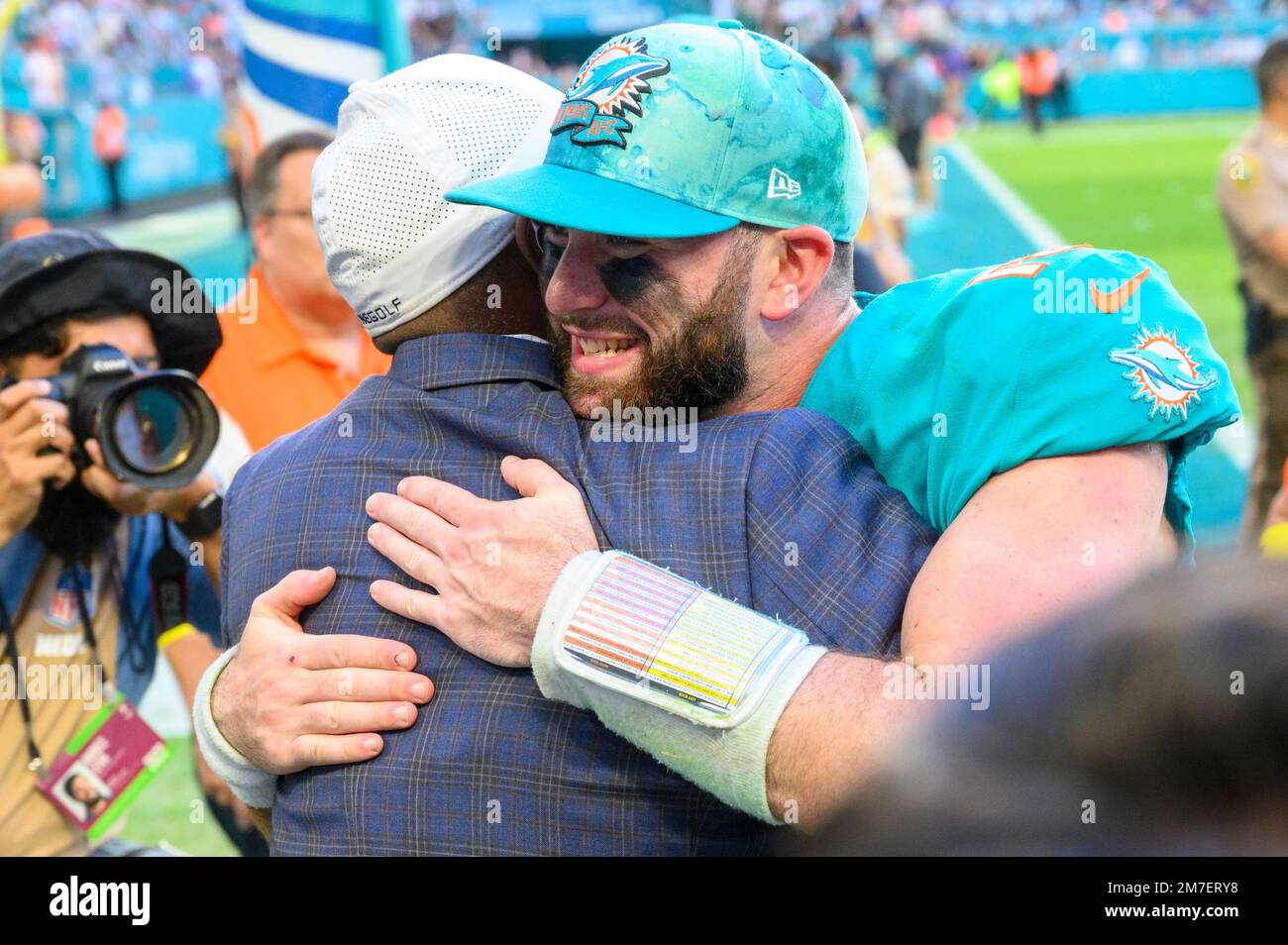Miami Dolphins quarterback Skylar Thompson (19) hugs Miami Dolphins ...