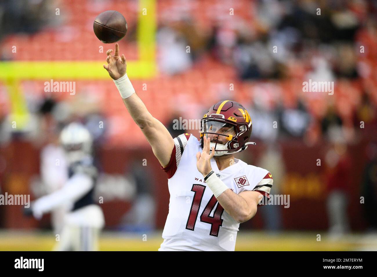 Washington Commanders quarterback Sam Howell (14) warms up the field before the start of an NFL ...