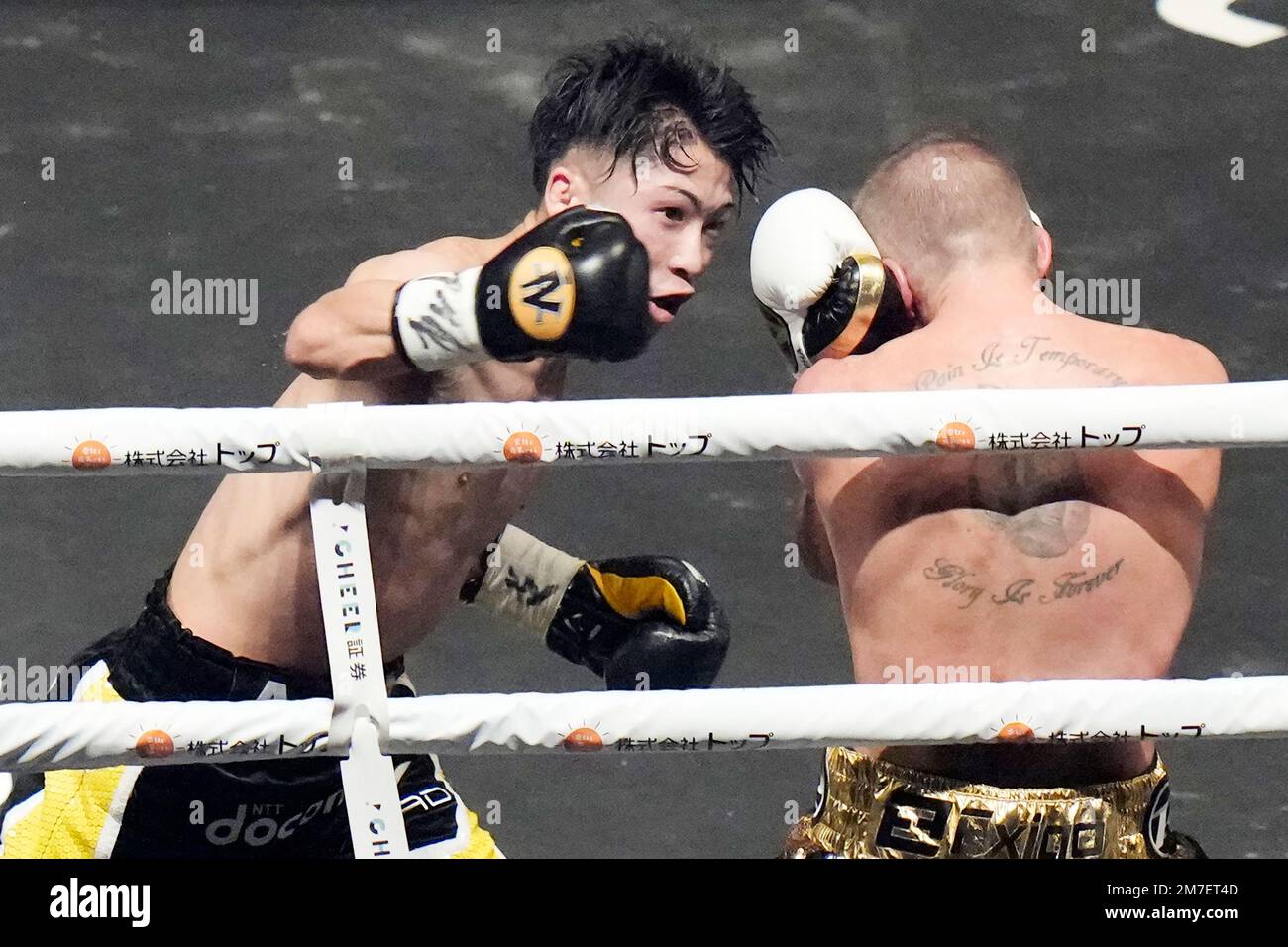 Naoya Inoue of Japan, left, throws a punch at Paul Butler of Britain ...