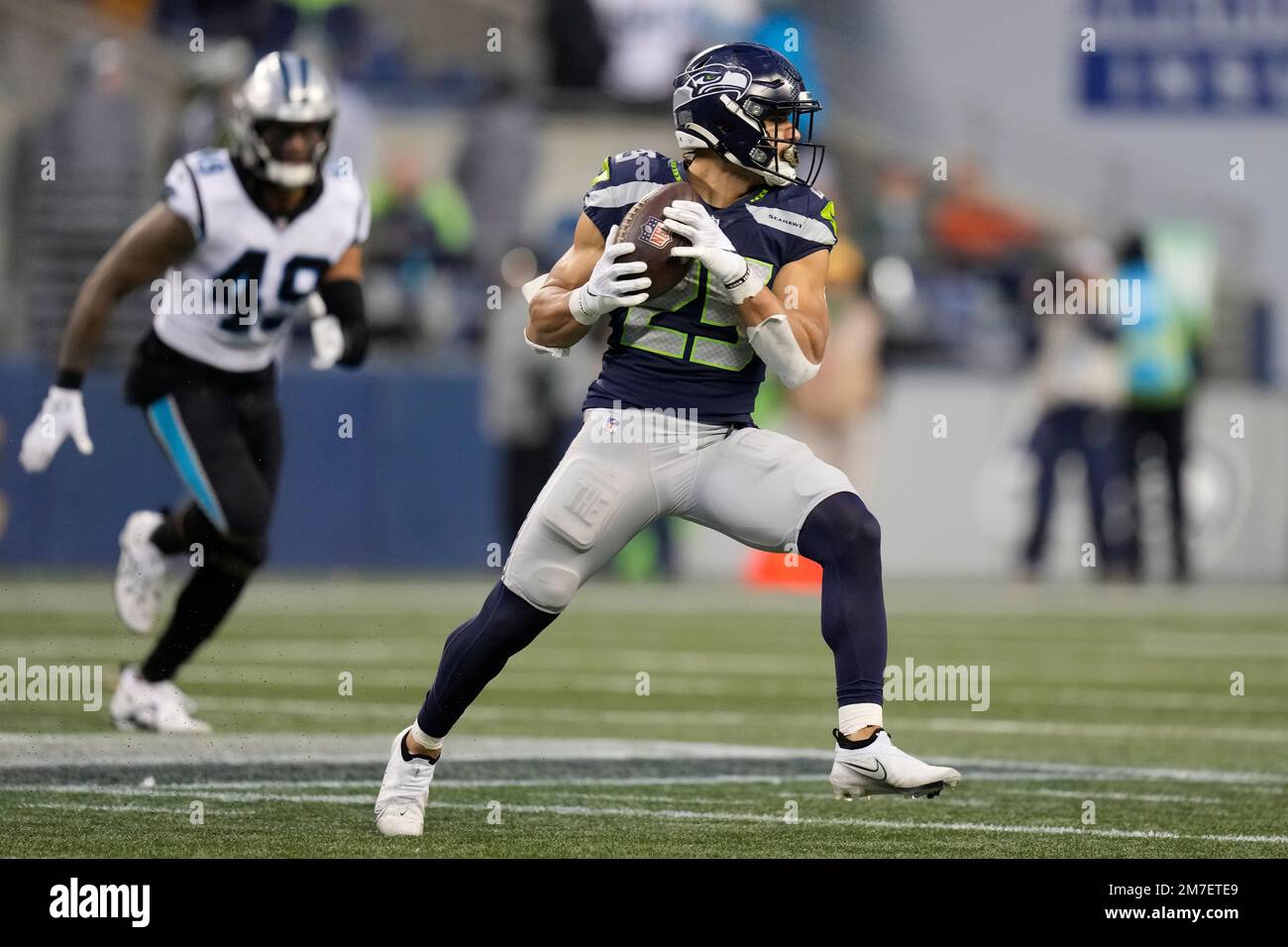 Seattle Seahawks running back Travis Homer (25) runs with the ball ...