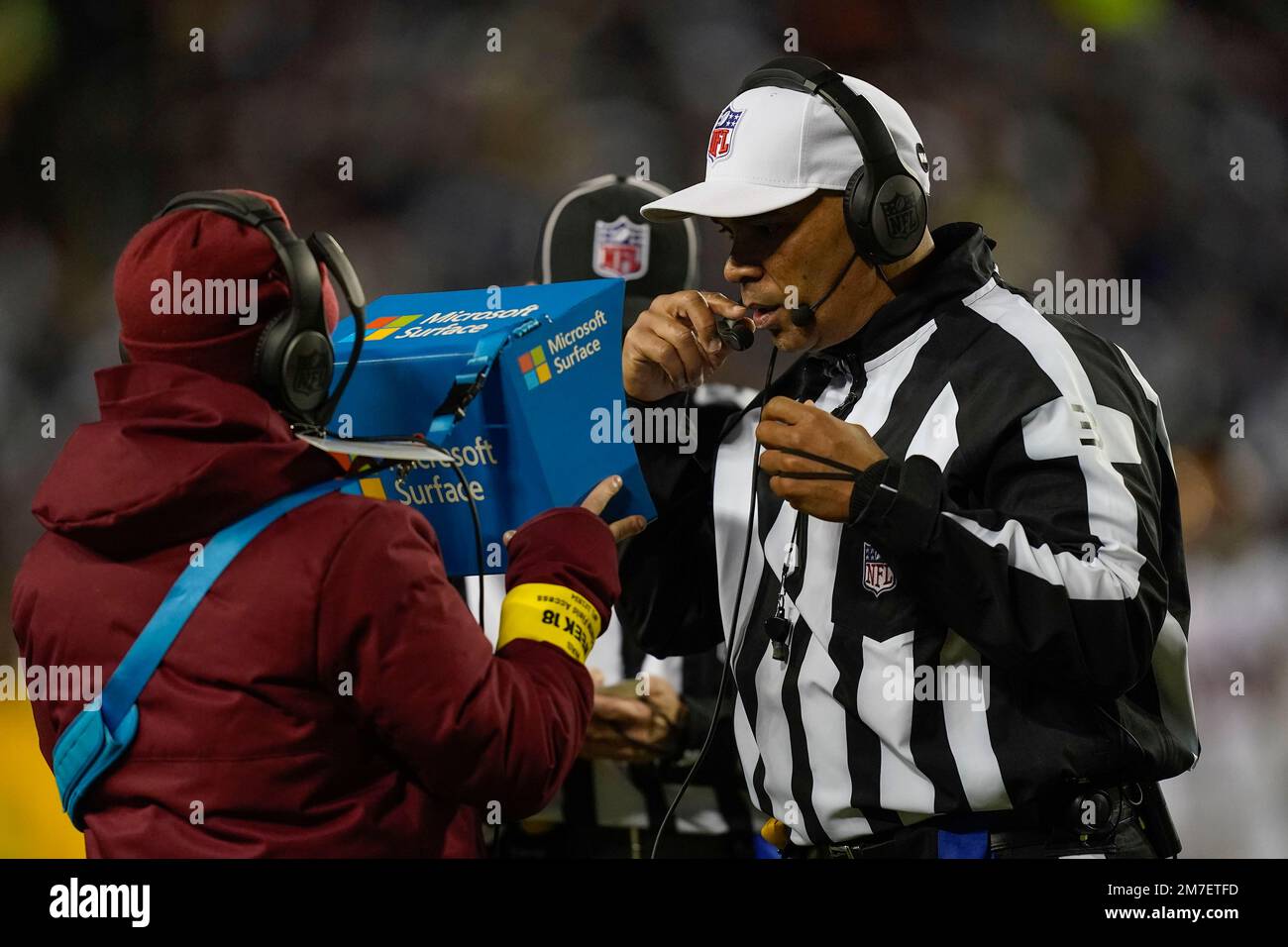 NFL referee Tra Blake (3) during a play review in the first half an NFL ...