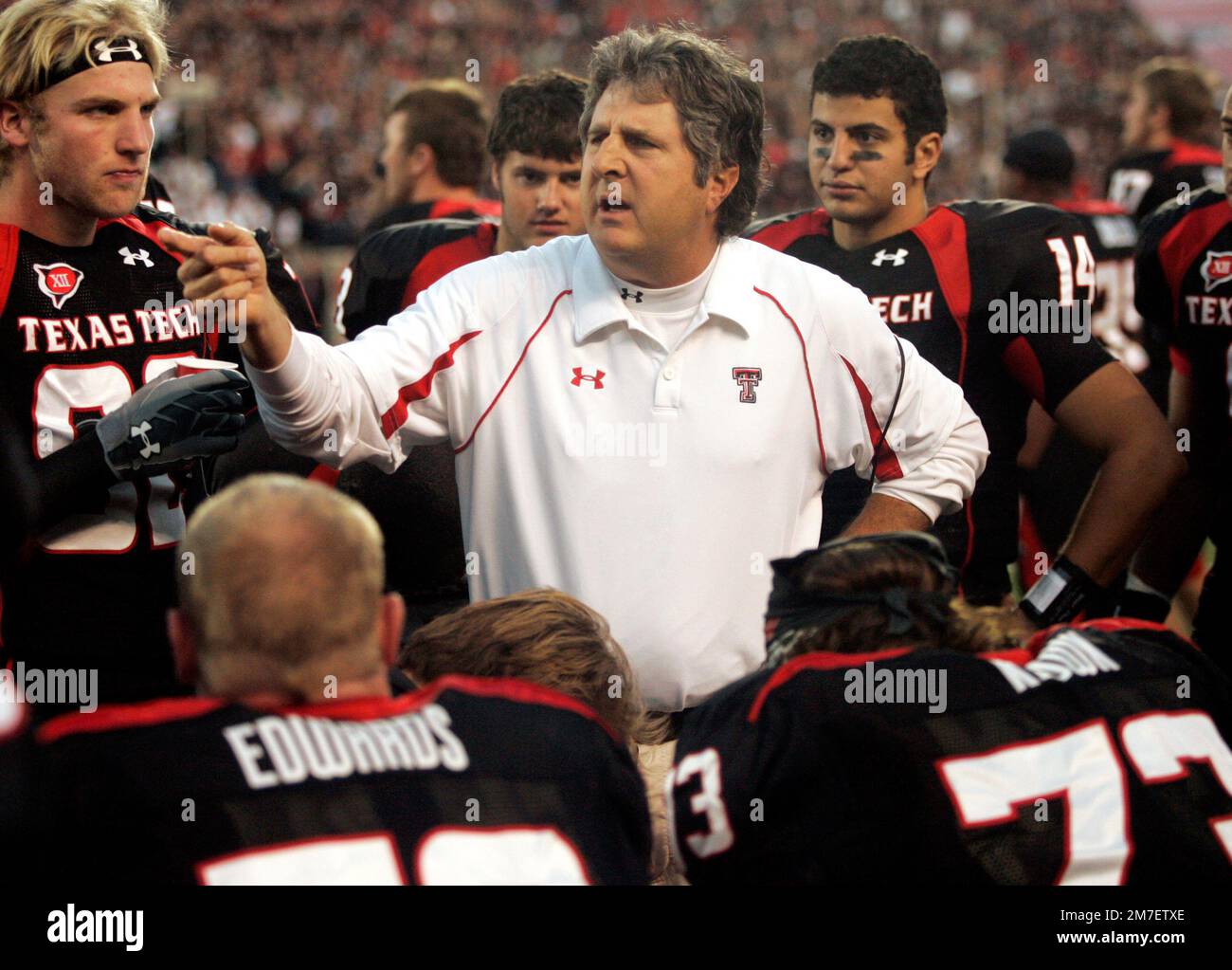 FILE - Texas Tech head coach Mike Leach talks with his team in the ...