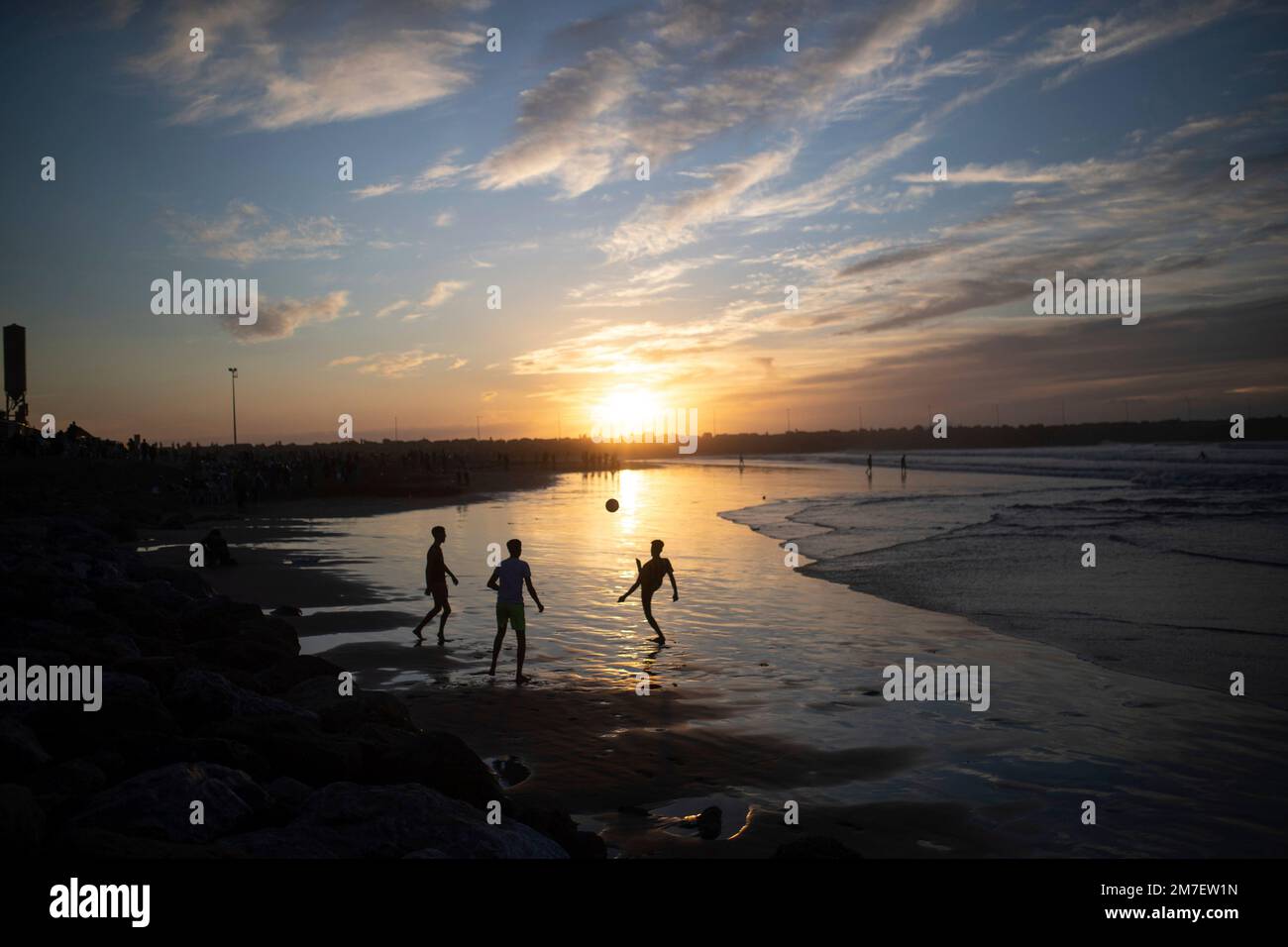 Boys play football on a beach in Rabat, Morocco, Monday, June 14, 2021 ...