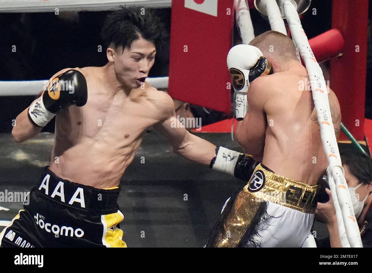 Naoya Inoue of Japan, left, throws a punch at Paul Butler of Britain ...