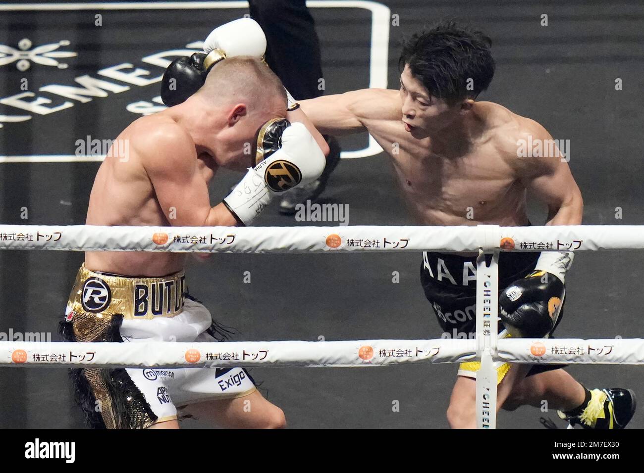 Naoya Inoue of Japan, right, throws a punch at Paul Butler of Britain ...