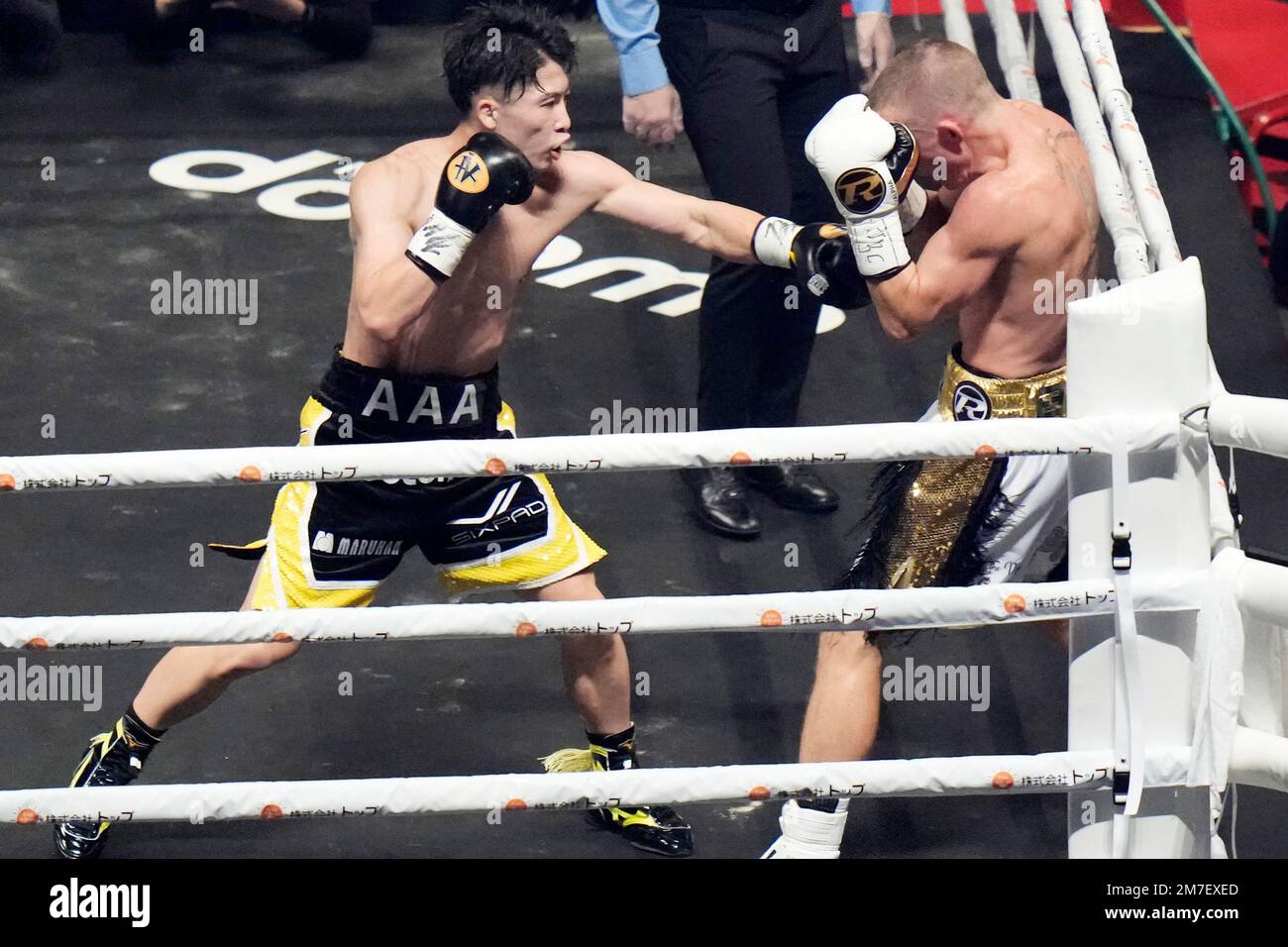 Naoya Inoue of Japan, left, throws a punch at Paul Butler of Britain ...