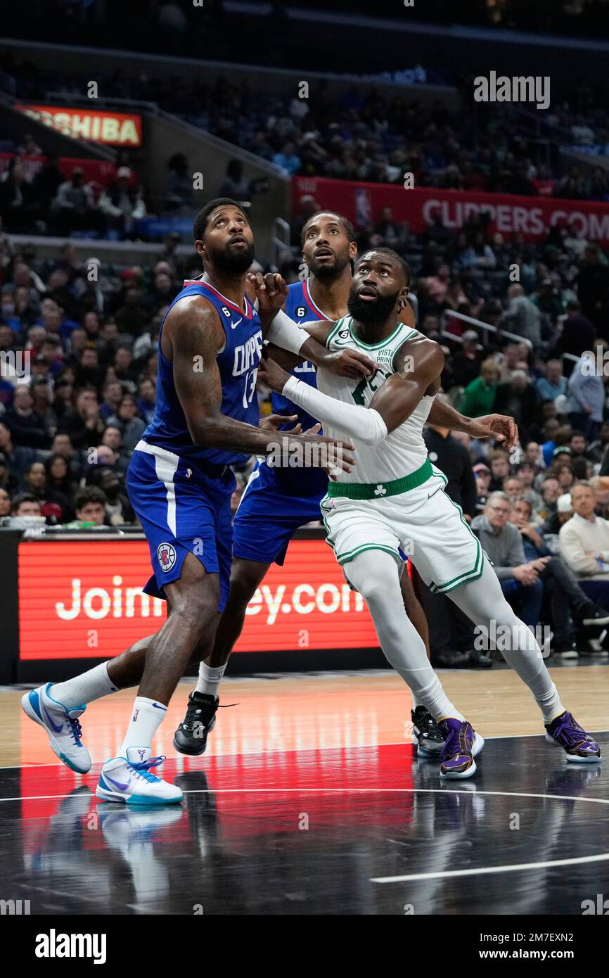 Los Angeles Clippers' Paul George, left, and Kawhi Leonard, center ...