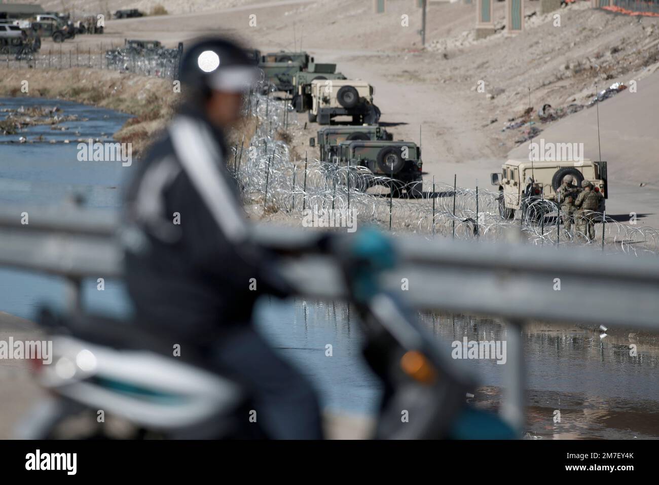 U.S. Military vehicles patrol the border between Mexico and the United ...