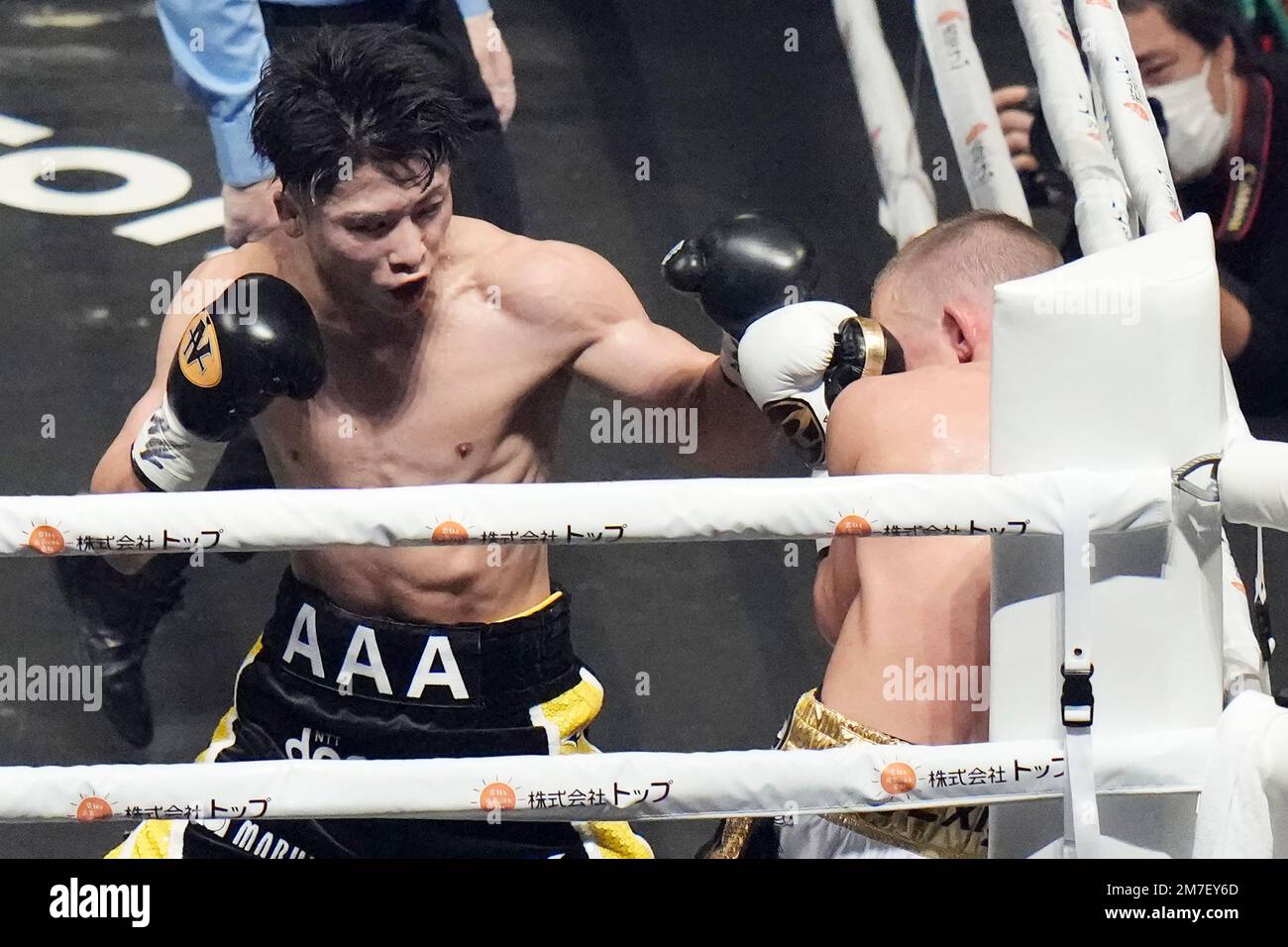 Naoya Inoue of Japan, left, throws a punch at Paul Butler of Britain ...