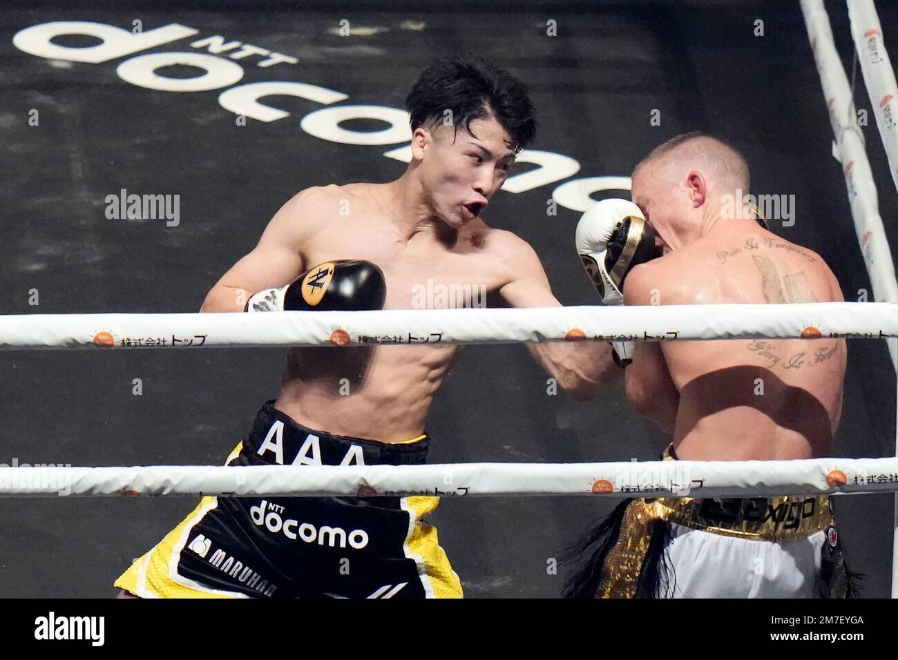 Naoya Inoue of Japan, left, throws a punch at Paul Butler of Britain ...