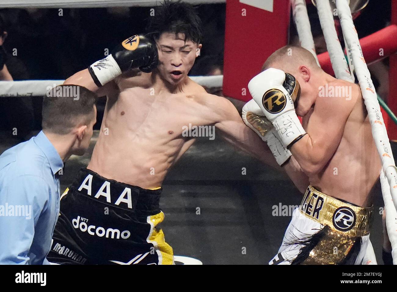 Naoya Inoue of Japan, left, throws a punch at Paul Butler of Britain ...
