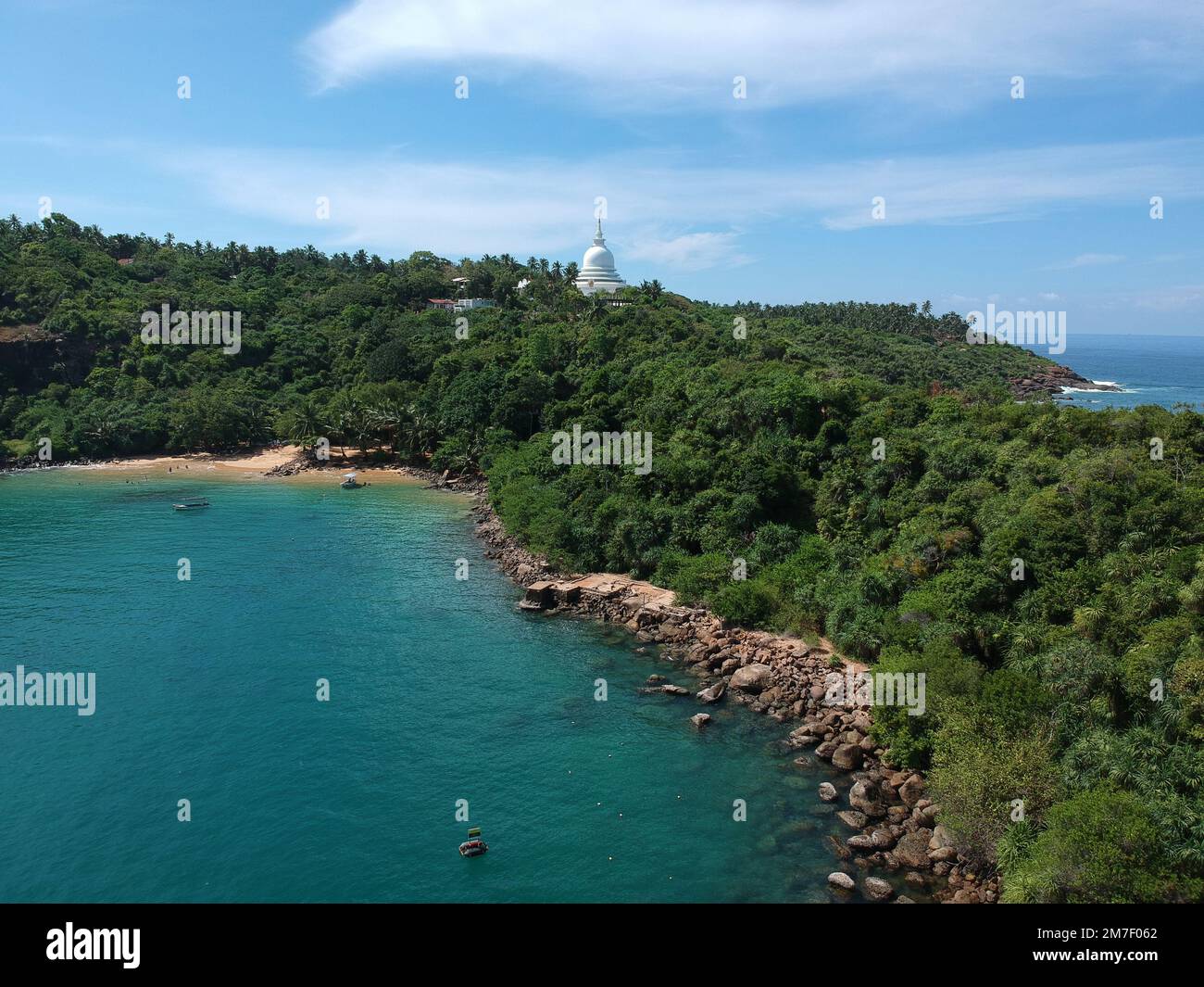 an Aerial shot over the Rumassala Sanctuary near a jungle beach Stock ...