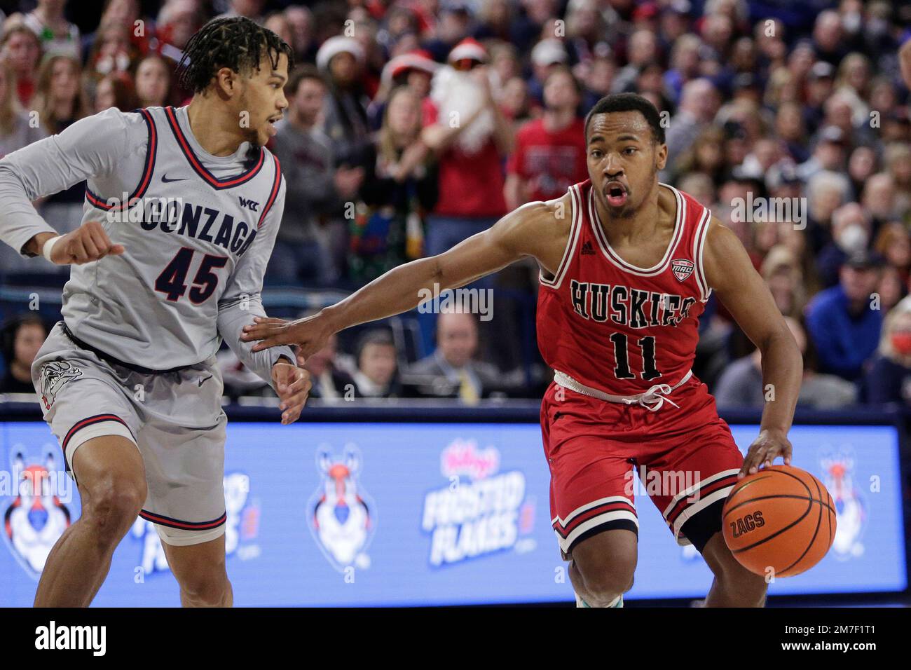Northern Illinois guard David Coit (11) drives the ball while defended ...