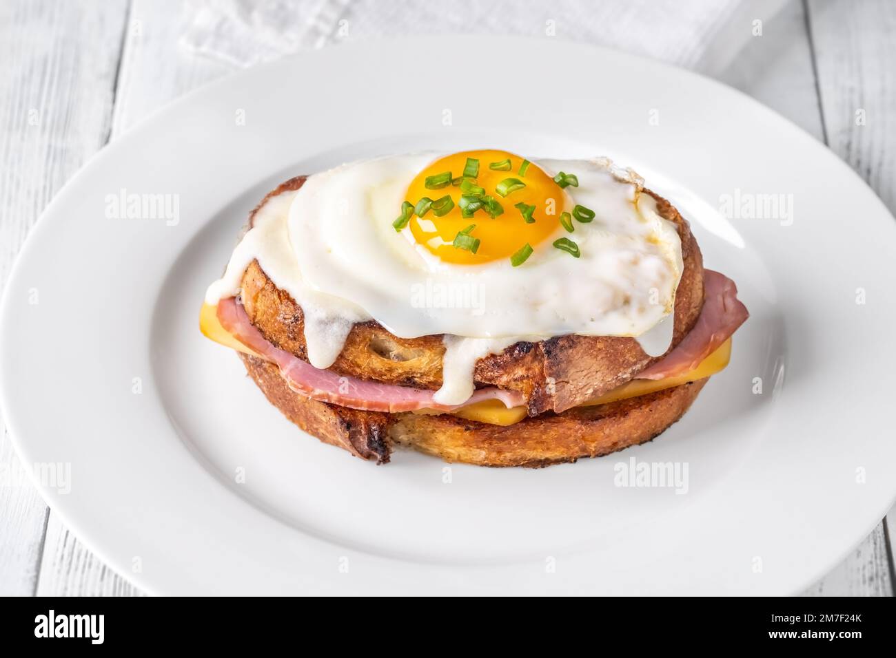 Croque madame hot sandwich made with ham, egg and cheese Stock Photo ...
