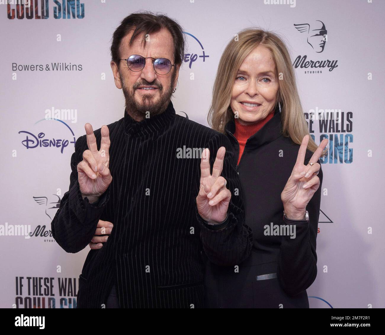 Ringo Starr, left, and Barbara Bach pose for photographers upon arrival ...