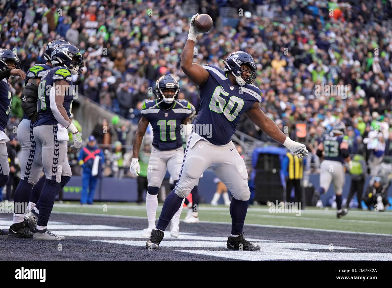 Seattle Seahawks guard Phil Haynes (60) spikes the ball during an NFL ...