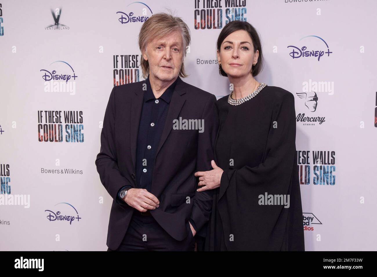 Paul McCartney, left, and Mary McCartney pose for photographers upon ...