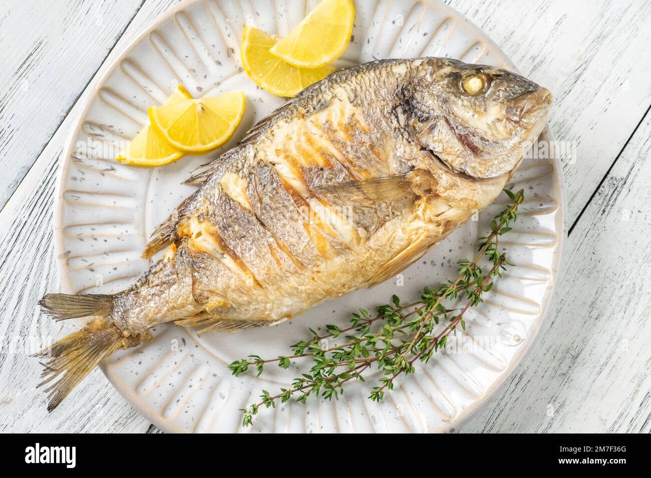 Mediterranean Baked Sea Bream Dorada fish with thyme Stock Photo - Alamy