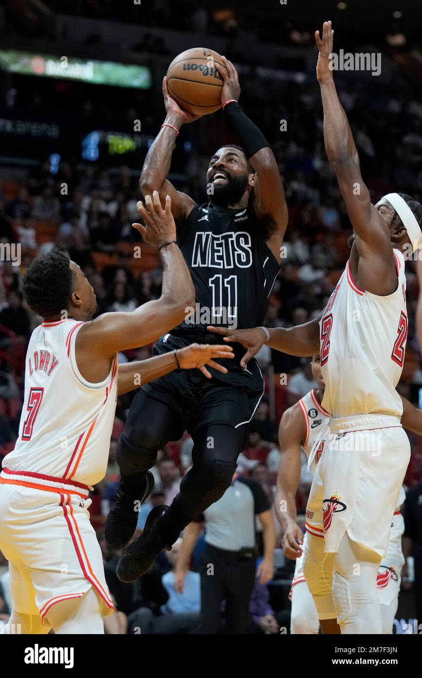 Brooklyn Nets guard Kyrie Irving (11) goes up for a shot against Miami ...
