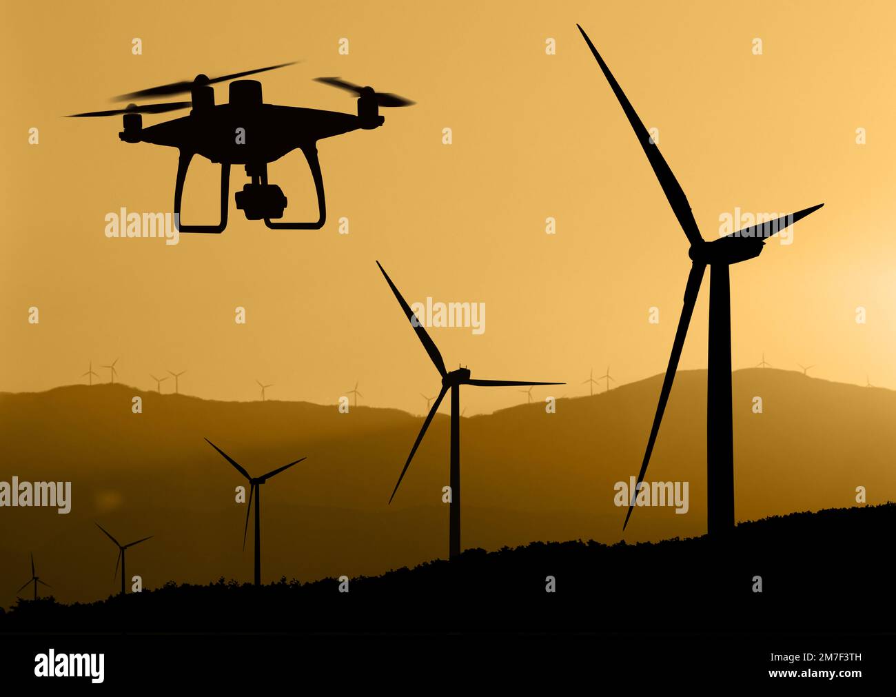 Silhouette of drone and wind turbines at sunset Stock Photo - Alamy