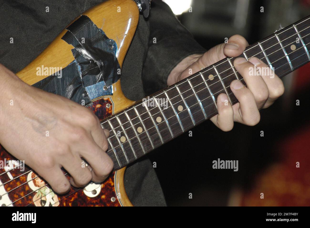 On fretboard playing chords hi-res stock photography and images - Alamy