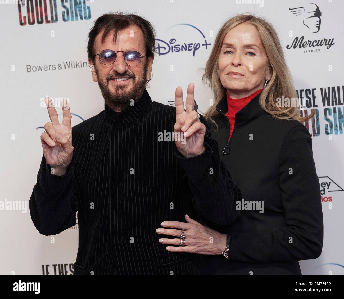 Ringo Starr, left, and Barbara Bach pose for photographers upon arrival ...
