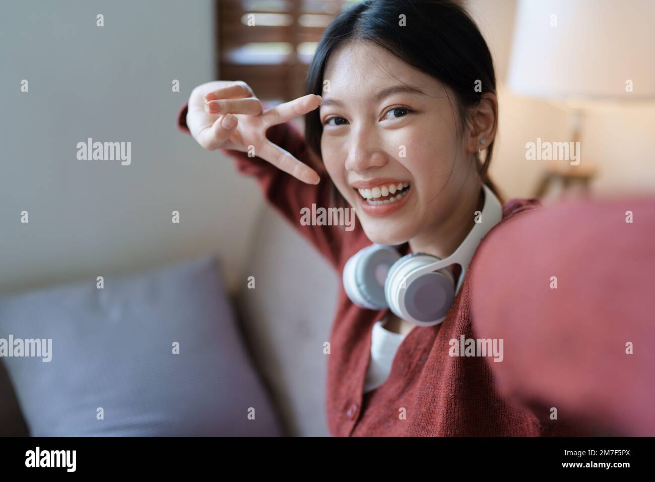 Portrait of beautiful Asian woman selfie with smiling face and showing ...
