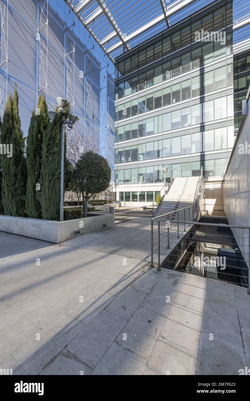 Facade of an office building with glass and metal, granite surfaces ...