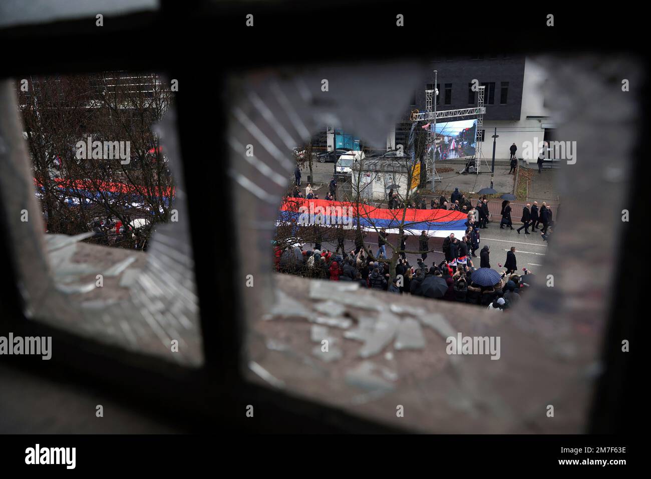 Bosnian Serbs march carrying a giant Serbian flag during a parade ...