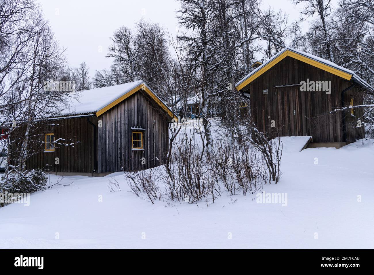 Beautiful little wooden mountain houses, huts surrounded by forest on a ...