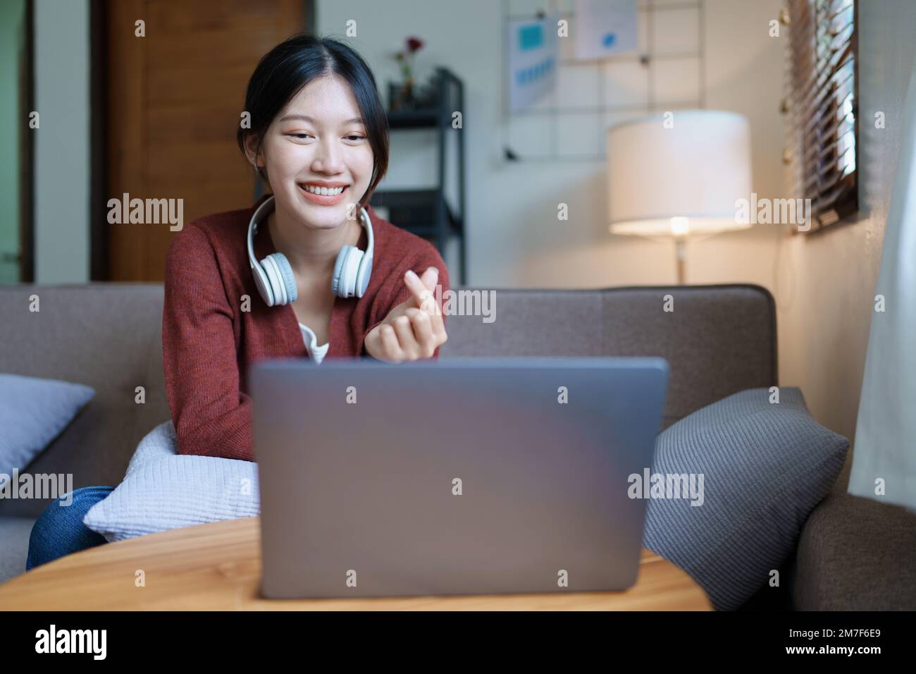 Portrait of a beautiful Asian teenage girl using a computer Stock Photo ...