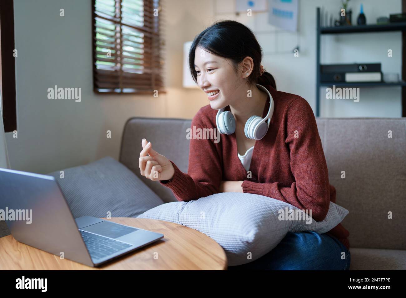 Portrait of a beautiful Asian teenage girl using a computer Stock Photo ...