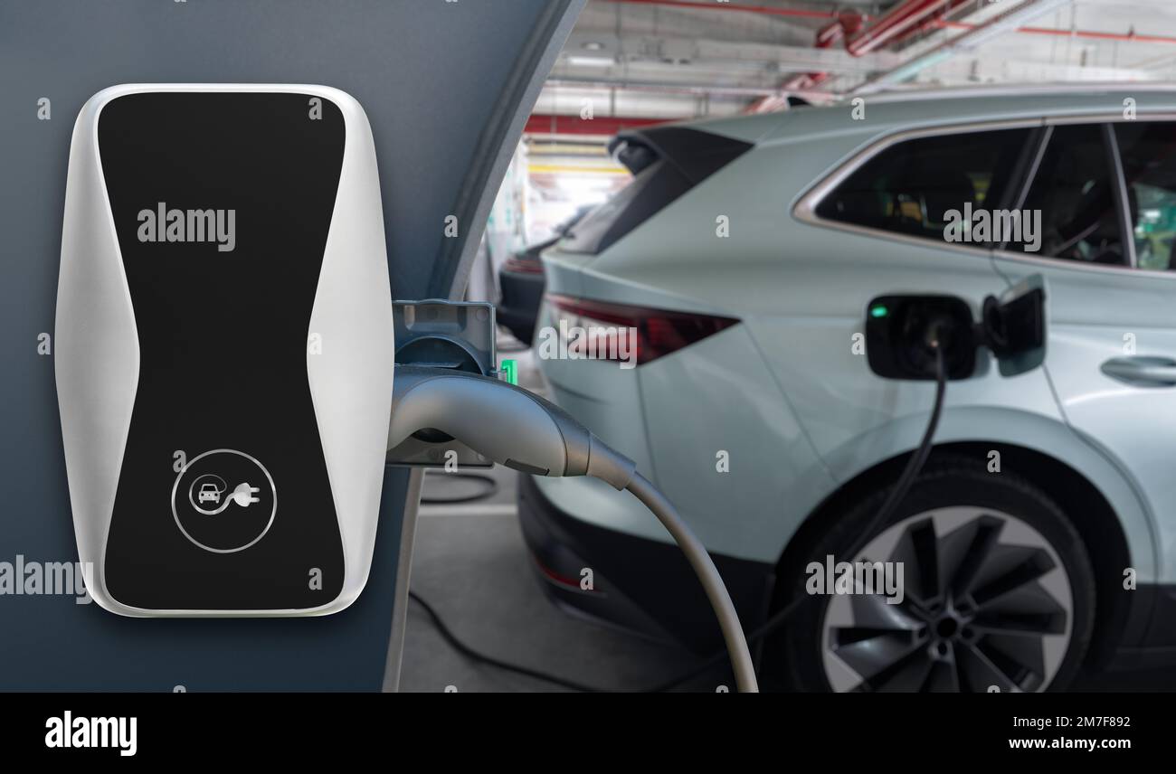 Electric car with charging station in the indoor parking of the ...