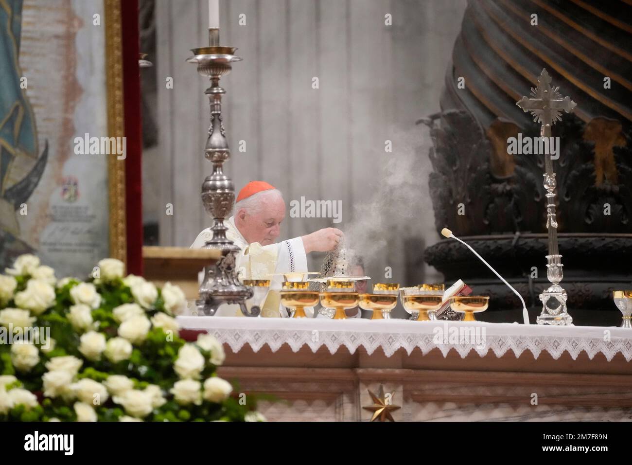 Cardinal Marc Ouellet asperges incense on the altar during a mass in ...