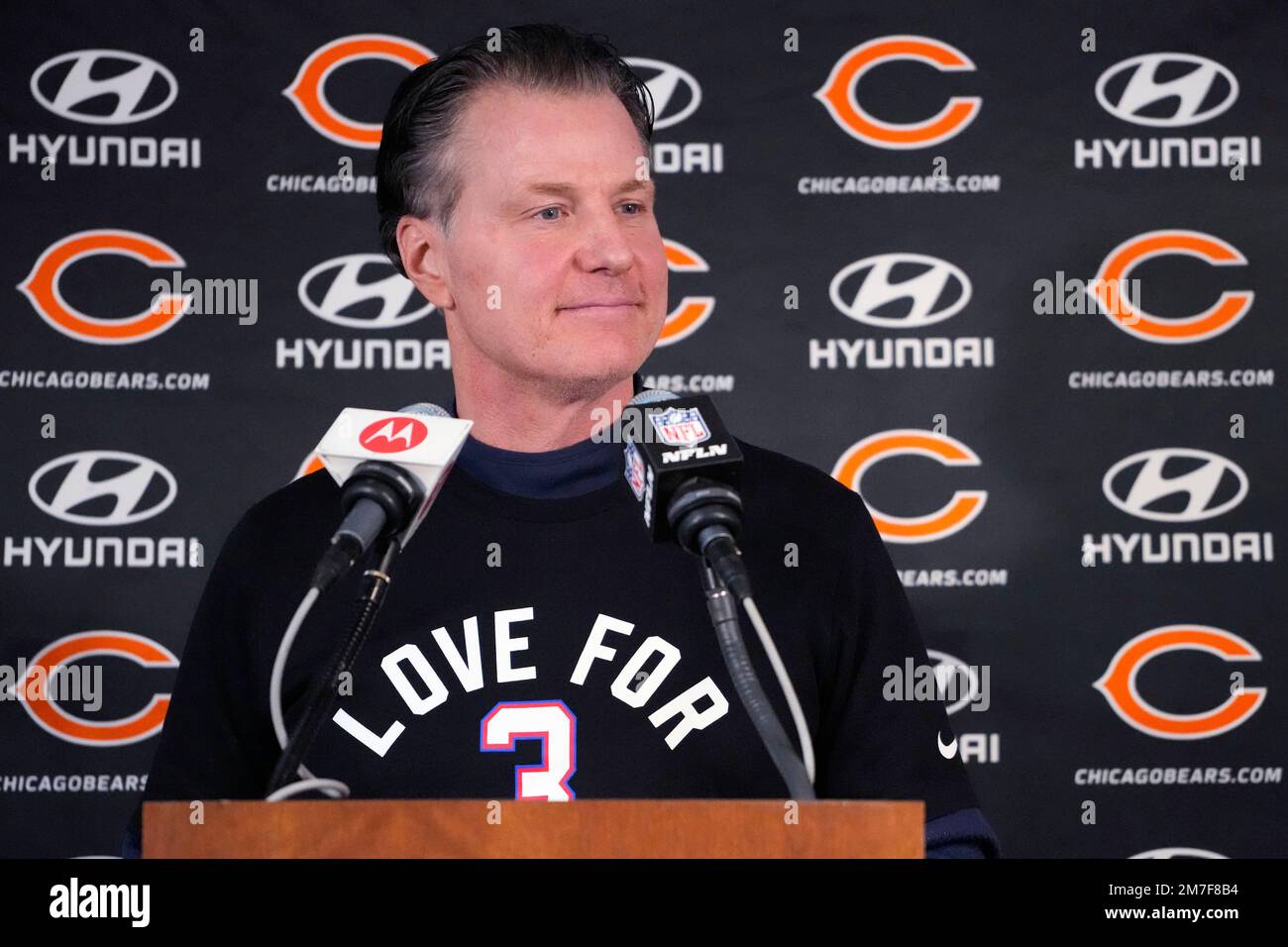 Chicago Bears head coach Matt Eberflus listens to reporters at a news ...