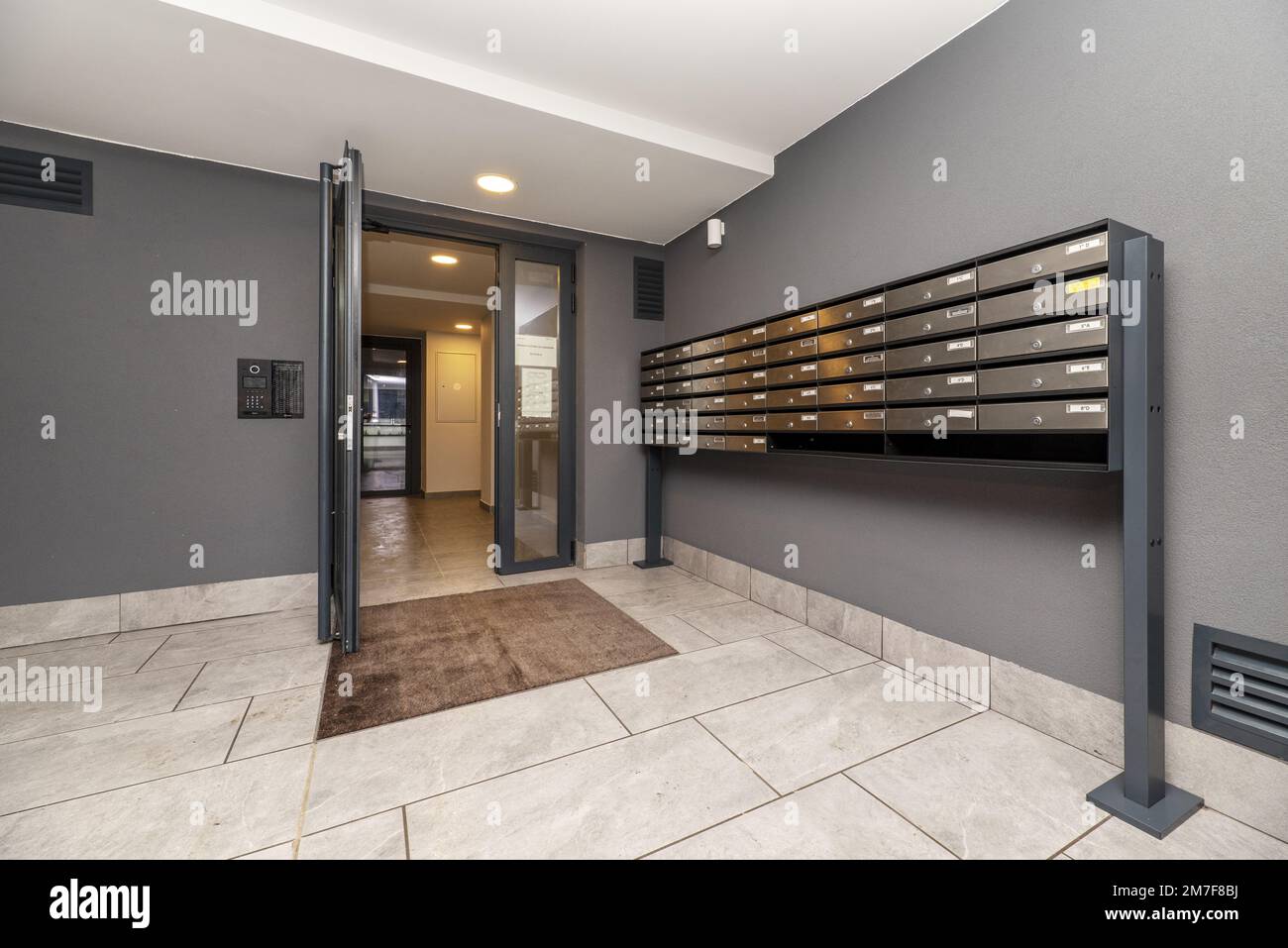 Lobby of a residential building with gray marble floors, 18 percent ...