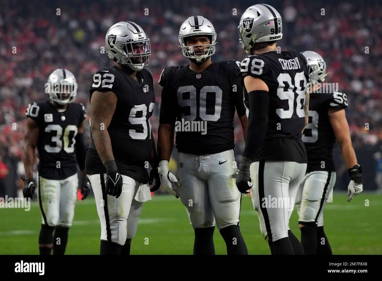 Las Vegas Raiders defensive tackle Neil Farrell Jr. (92) and defensive ...
