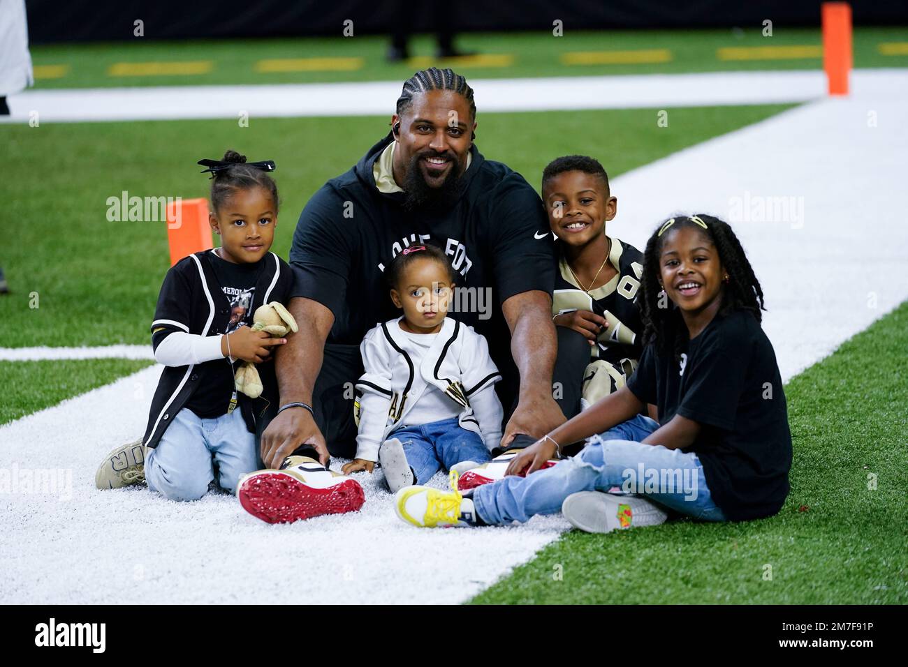 New Orleans Saints defensive end Cameron Jordan poses with his children ...