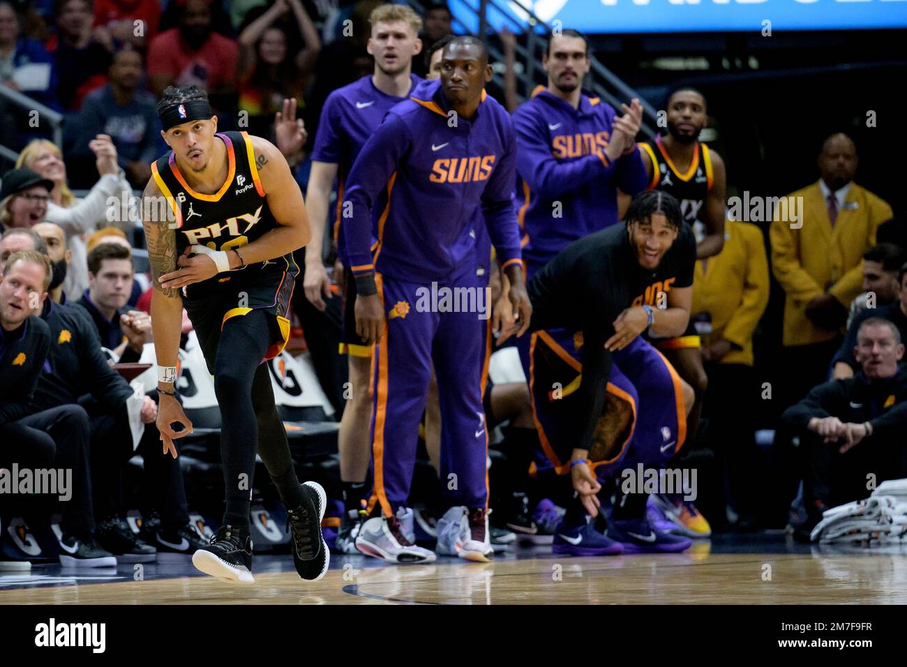 Phoenix Suns guard Damion Lee (10) signals a three point basket in the ...