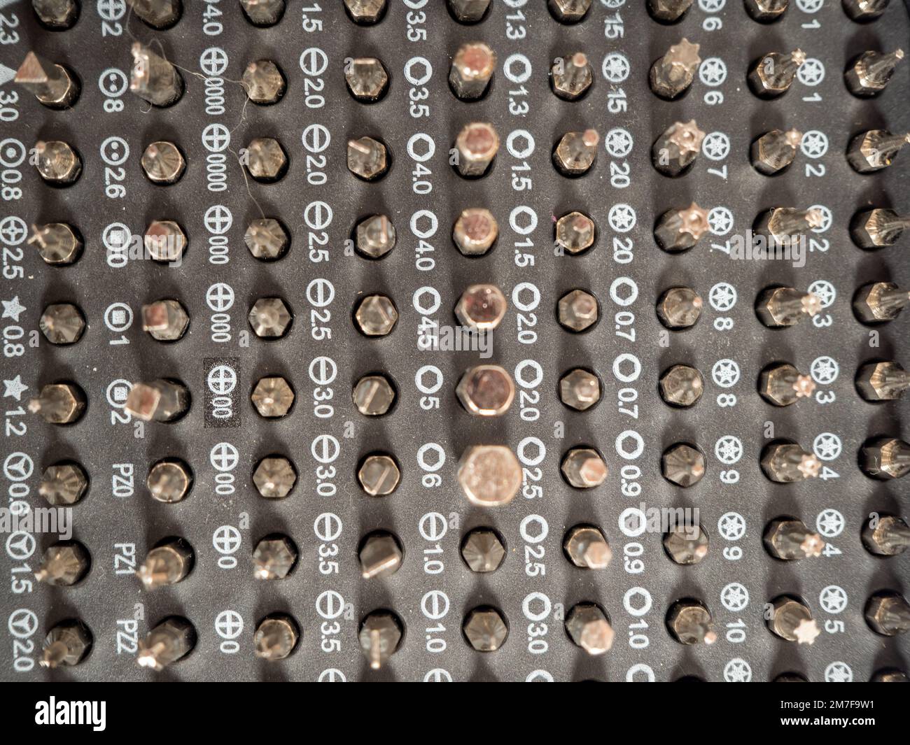 Universal set of screwdriver bits with different bits. Close-up bit set ...