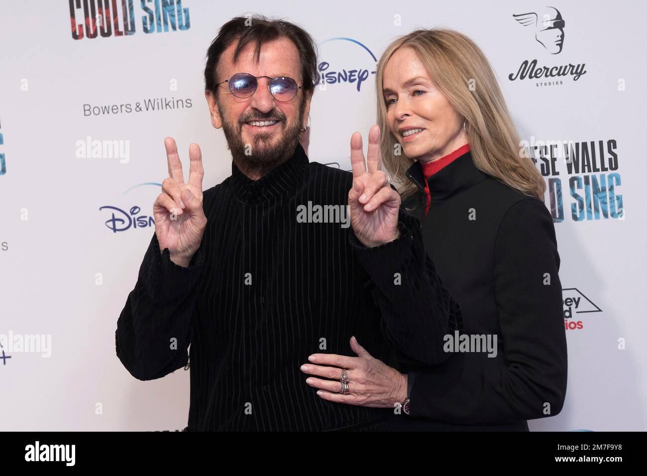 Ringo Starr, left, and Barbara Bach pose for photographers upon arrival ...