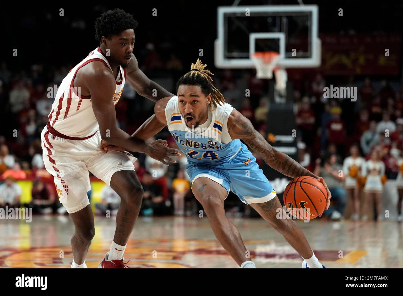 McNeese State forward Christian Shumate, right, drives the ball inside ...