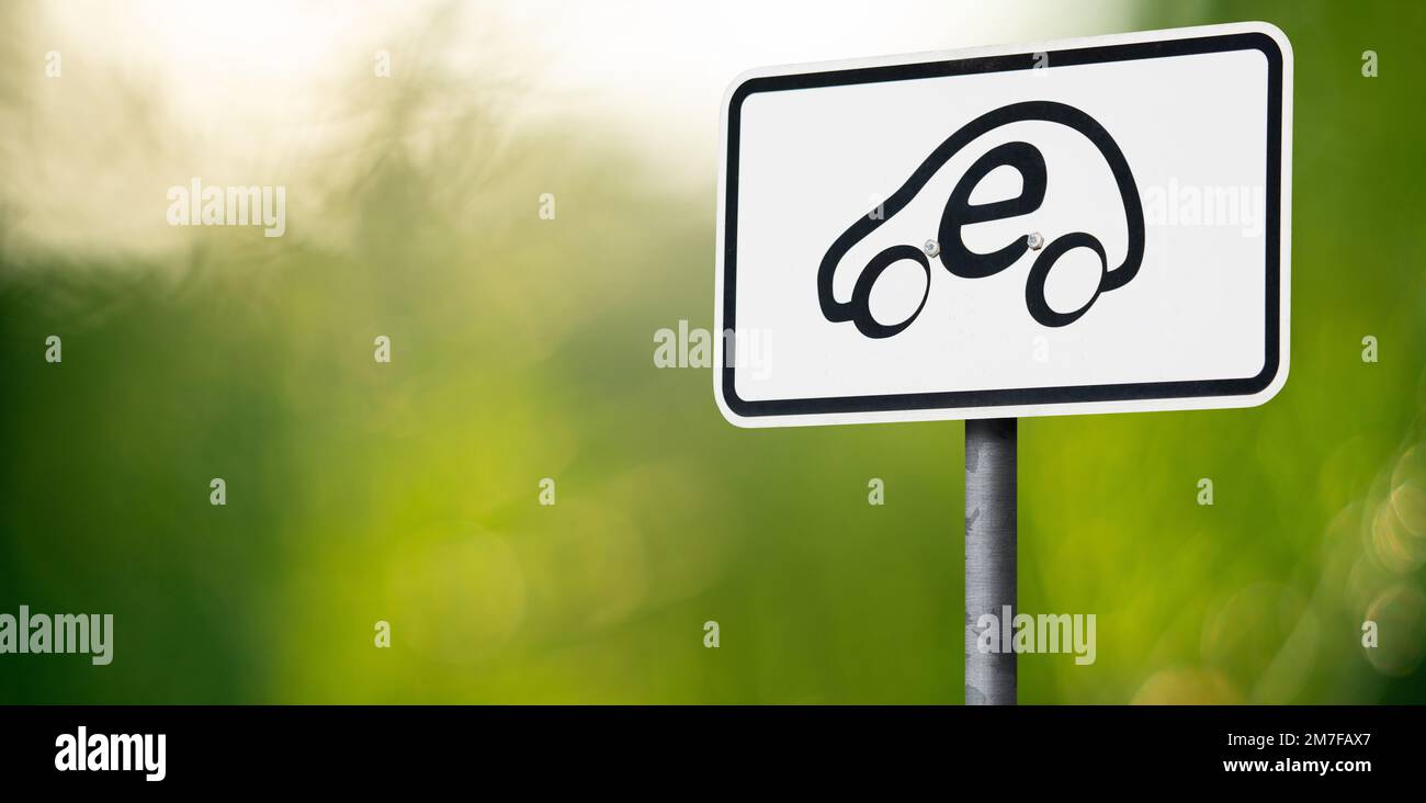 Road sign with electric car symbol Stock Photo - Alamy