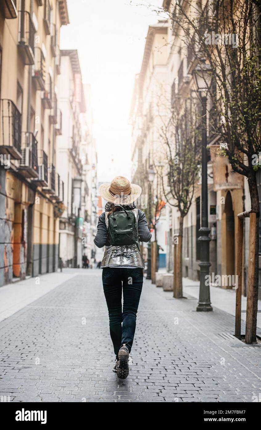 Woman back view walking street hi-res stock photography and images - Alamy