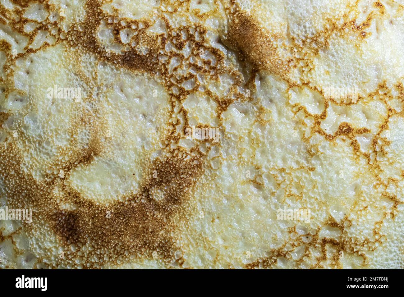 Pancake surface texture and pattern. Close-up of thin hot pancakes in a ...