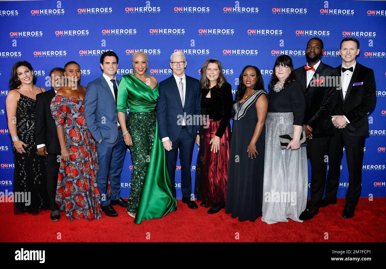 CNN news anchor Anderson Cooper, center, poses with honorees, from left ...