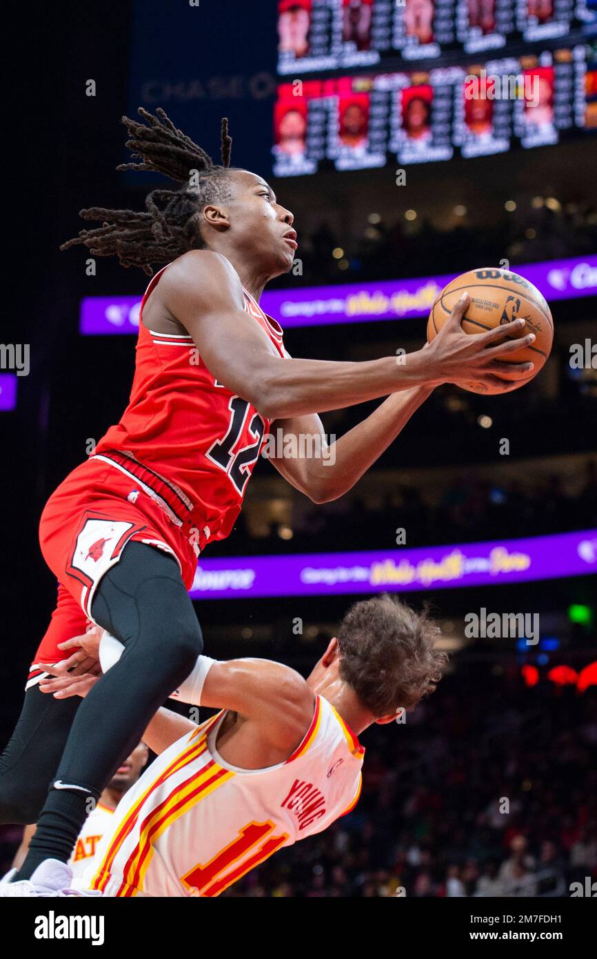 Chicago Bulls guard Ayo Dosunmu (12) knocks down Atlanta Hawks guard ...