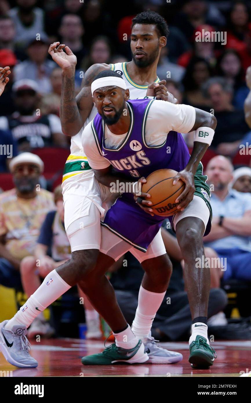 Milwaukee Bucks forward Bobby Portis Jr., front, looks to pass the ball ...